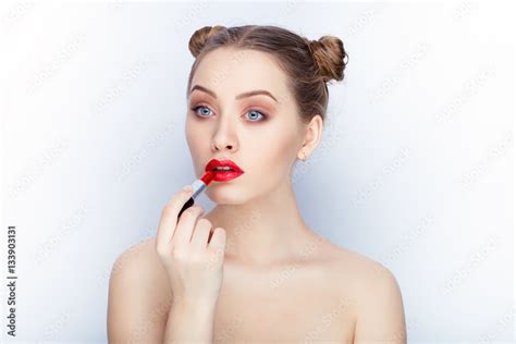 Young Pretty Woman Trendy Makeup Bright Red Lips Bun Hairstyle Bare