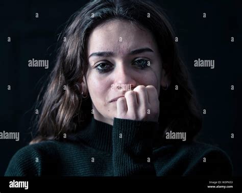 Dramatic Closeup Portrait Of Young Scared Depressed Girl Crying Alone