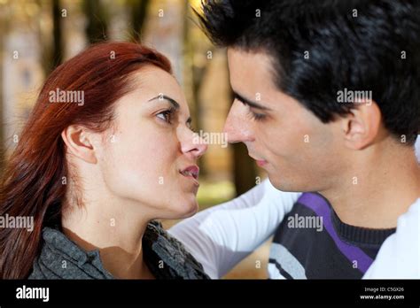 Love and affection between a young couple at the park (selective focus ...