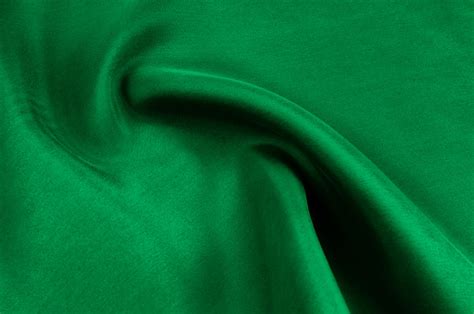 배경 질감 패턴입니다 두꺼운 두꺼운 실크 직물은 녹색입니다 이 새틴 직물 디자인에 부드러운 흐름을 만들기 위한 이상적입니다 그리고 그것은 액체 드 레이프와 절묘 한 광택 0