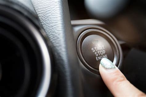Premium Photo Close Up Of Woman Pushing Button In Car