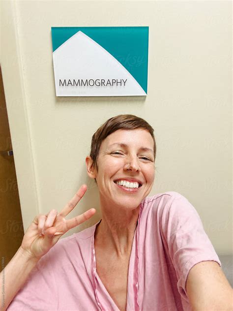 Woman Taking Selfie While Waiting For Mammogram By Stocksy