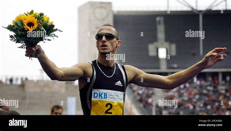 United States Jeremy Wariner Celebrates After Crossing The Finish Line