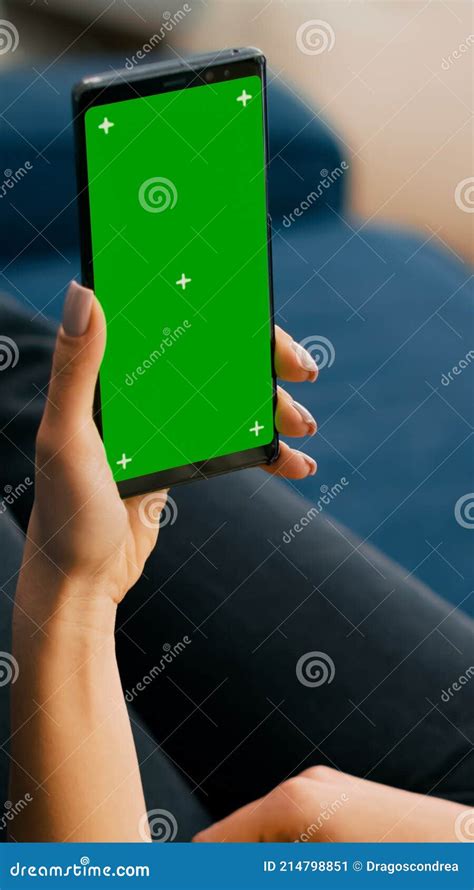 Freelancer Holding in Vertical Mode Smartphone with Mock Up Green ...
