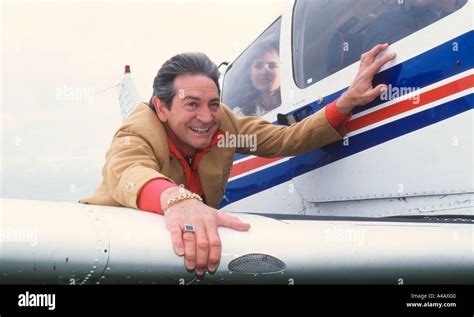 Actor Patrick Mower Emmerdales Rodney Blackstock Hanging Onto A Light