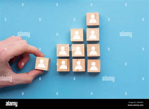 Hand Adding A New Team Member To A Group Business Management Concept