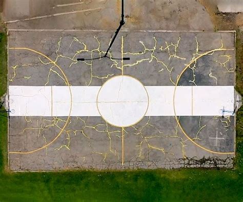 Artist Mends Cracked Basketball Court Using Traditional Japanese Kintsugi