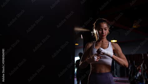 Portrait Of Woman Learning Muay Thai To Build Up The Strength Of The