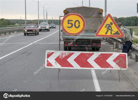 Road Works Are Underway On The Bridge Over The River For The Safety Of