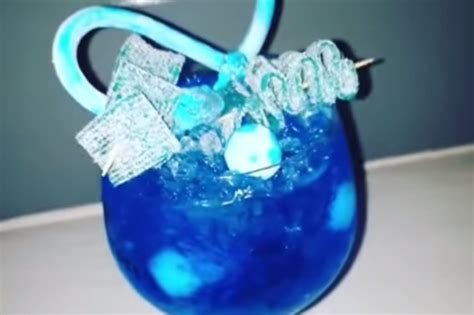 Woman Shows How To Make Bright Blue Raspberry Explosion Cocktail At