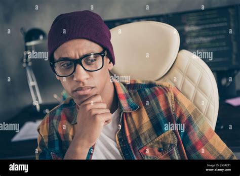 Photo Of Ponder Pensive Freelancer Wear Hat Glasses Thinking Code Problem Solving Indoors