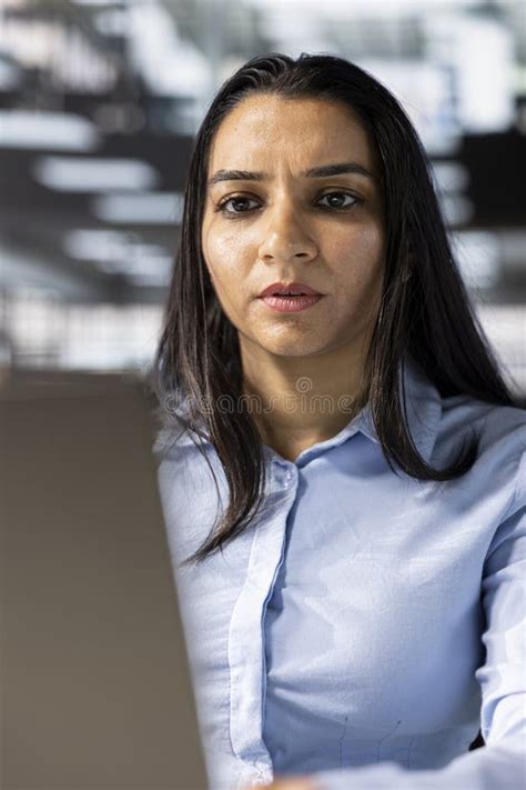 Indian Businesswoman Reviews Financial Plans Using Online Tools Stock