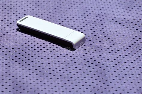 A Modern Portable Usb Wi Fi Adapter Is Placed On The Violet Sportswear