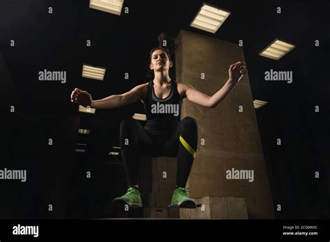 Fit Young Woman Box Jumping At A Crossfit Style Gym Female Athlete Is