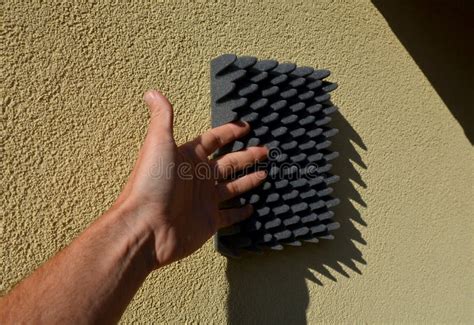 Installation Of Anti Noise Foam Tiles Is Demonstrated By The Seller