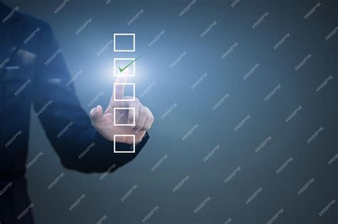 Premium Photo Businessman Touch Checking Mark In A Checkbox On Blue Background Copy Space
