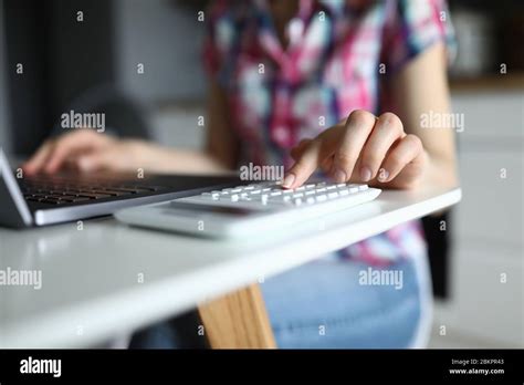 Female Hand Push Button On White Calculator Closeup Stock Photo Alamy