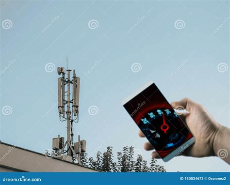 Cell Phone Base Station On Roof And Mobile Network Speedometer On Phone