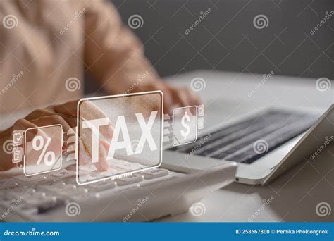 Accountants Pressing Calculator And Using Laptop To Calculate And