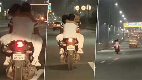 Ghaziabad Couple Romance On Speeding Bike While Zooming Past Busy