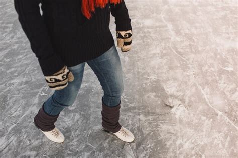 Premium Photo Low Section Of Woman Ice Skating On Frozen Lake
