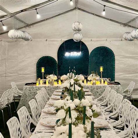 Elegant Banquet Table Decor Featuring Backdrop Stands Candles Dinnerware Flowers And Led