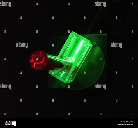 Laser And Ruby Rod Experiment With A Green Laser Beam Being Used To Induce Red Luminescence In
