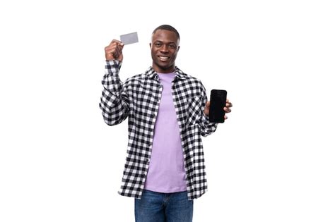 Premium Photo A Handsome Year Old African Guy Dressed In A Plaid