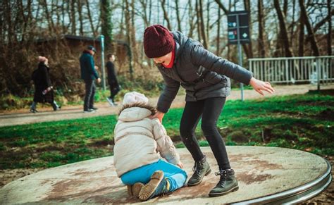 Premium Photo Full Length Two Girls Playing In Park During Winter