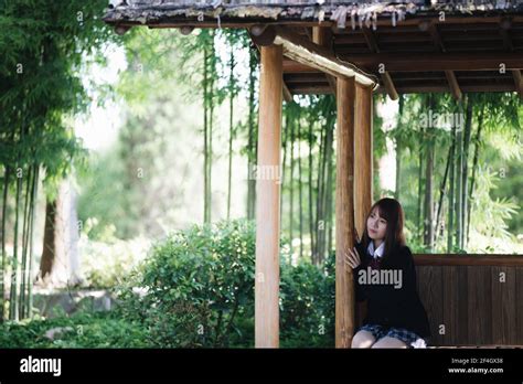 Portrait Of Asian Japanese School Girl Costume Looking At Park Outdoor