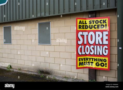 Closing Down Signs In The Windows Of A Large Shop In The UK Stock Photo