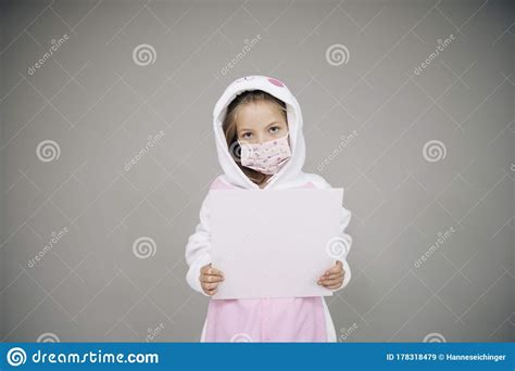 Beautiful Girl Dressed As Easter Bunny Rabbit With Face Protective Mask
