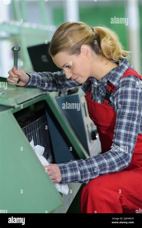 Woman Operating A Machine With Tools Stock Photo Alamy