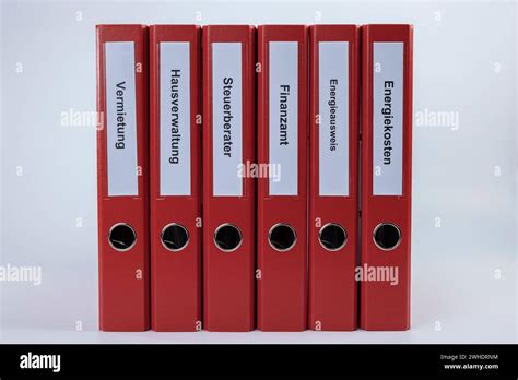 Red File Folders Labeled Rental Property Management Tax Consultant