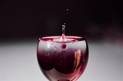 Premium Photo Close Up Of Red Wine Over Gray Background