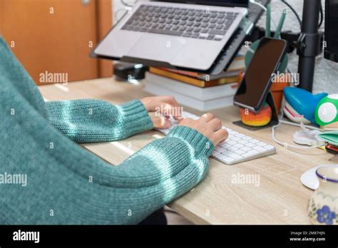 Young Womans Hands Typing On Desktop Computer Keyboard While Working