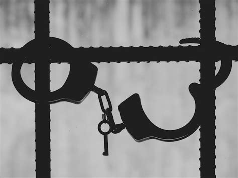 Premium Photo Close Up Of Handcuffs On Security Bars