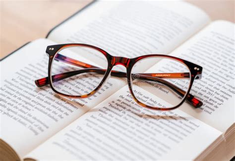 Glasses And Books A Pair Of Reading Glasses Placed On Top Of An Stock