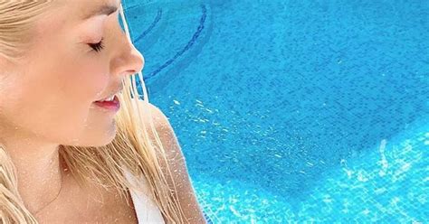 Holly Willoughby Flaunts Cleavage In Daringly Plunging Swimsuit For