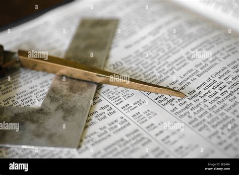 Masonic Symbol Of A Set Square And Pair Of Compasses On An Open Bible