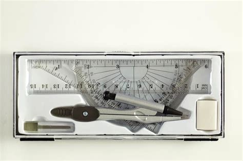 Premium Photo Close Up Of Set Square With Protractor Over White