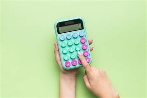 Premium Photo The Girl S Hands Do Calculations On A Calculator On A