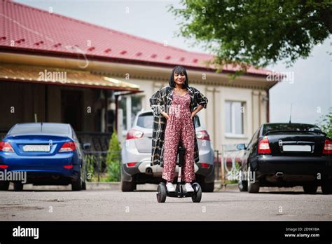 Beautiful African American Woman Using Segway Or Hoverboard Black Girl
