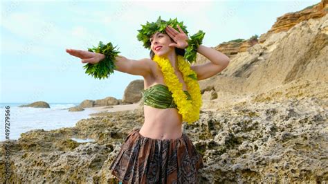 Happy And Calm Woman Poses On The Beach Wearing The Typical Hula Dance