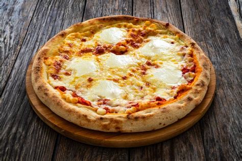 Margherita Pizza With Tomato Sauce And Mozzarella Cheese On Wooden