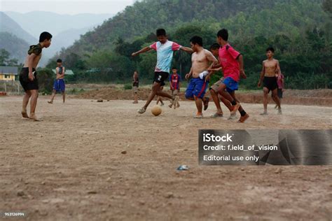 Teams Of Teenage And Young Thaiyai Boys Playing Soccer Football On A