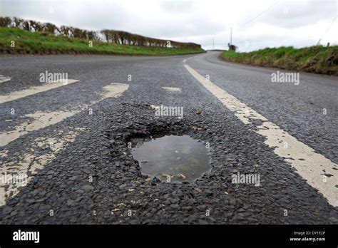 Pothole Road With Pothole Uk Stock Photo Alamy
