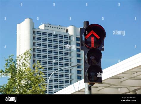 Red Traffic Light In The City Streets With Red Arrow Traffic Light