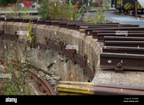 A Rounded Ledge With Rusted Steel Rails Around The Perimeter Stock