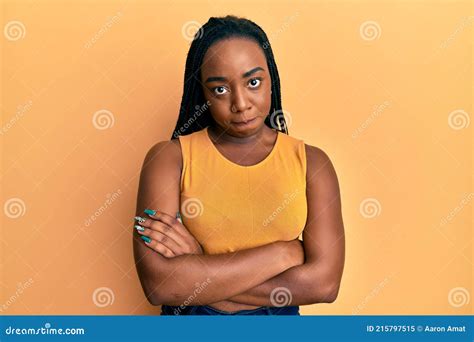 Young African American Woman With Arms Crossed Gesture Skeptic And